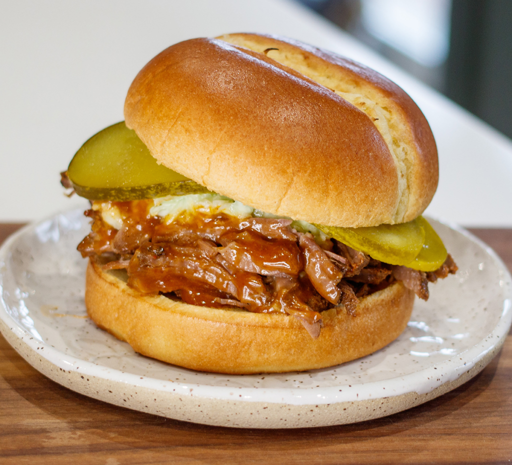 Zesty Slow Cooker Pulled Beef Brisket Sandwich with Pickles and Slaw ...